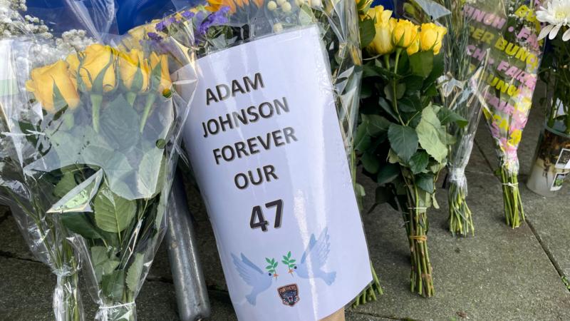 Fans pay tribute to ice hockey player Adam Johnson one year on - BBC News