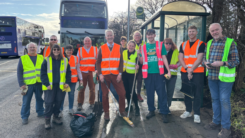 Taunton volunteers come together to clean A38 bus stops - BBC News