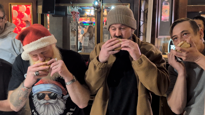 Wigan pie-eating champion polishes off pie in 64 seconds - BBC News