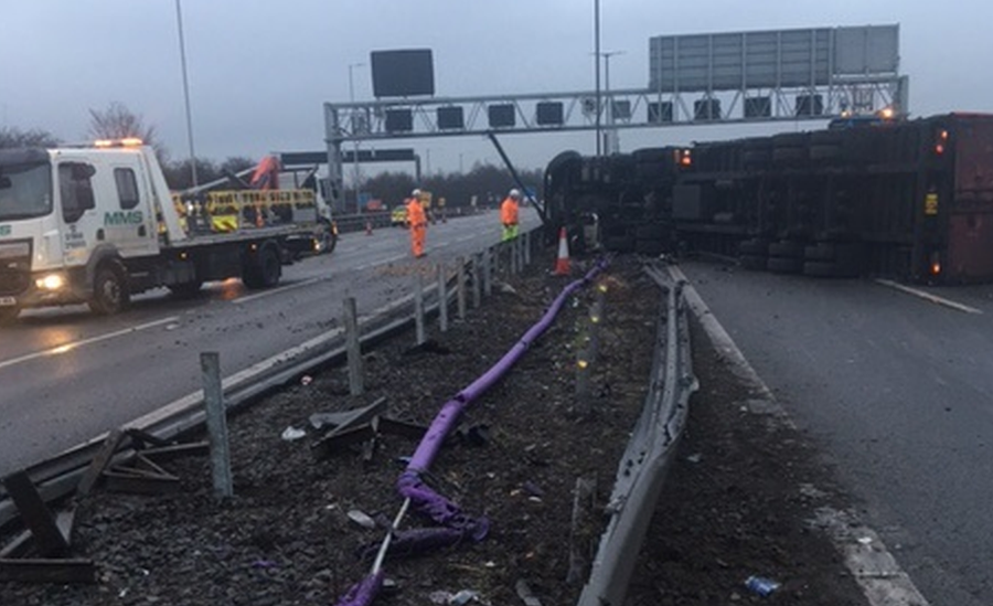 M6 closes at Walsall after lorry crashes through central barrier - BBC News