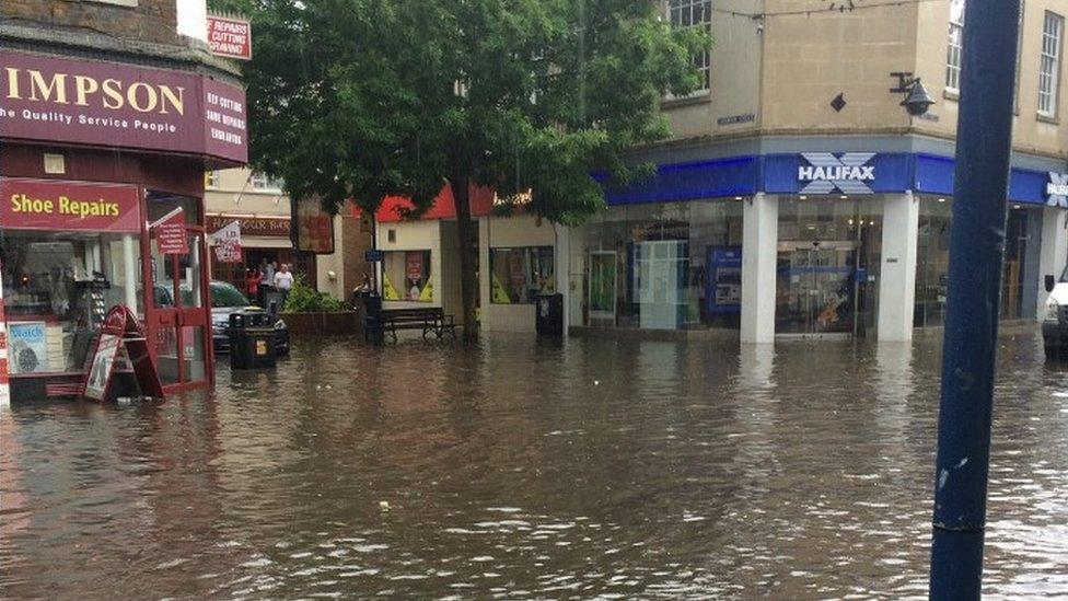 Two rescued from submerged car in 'significant' flooding in Kent - BBC News