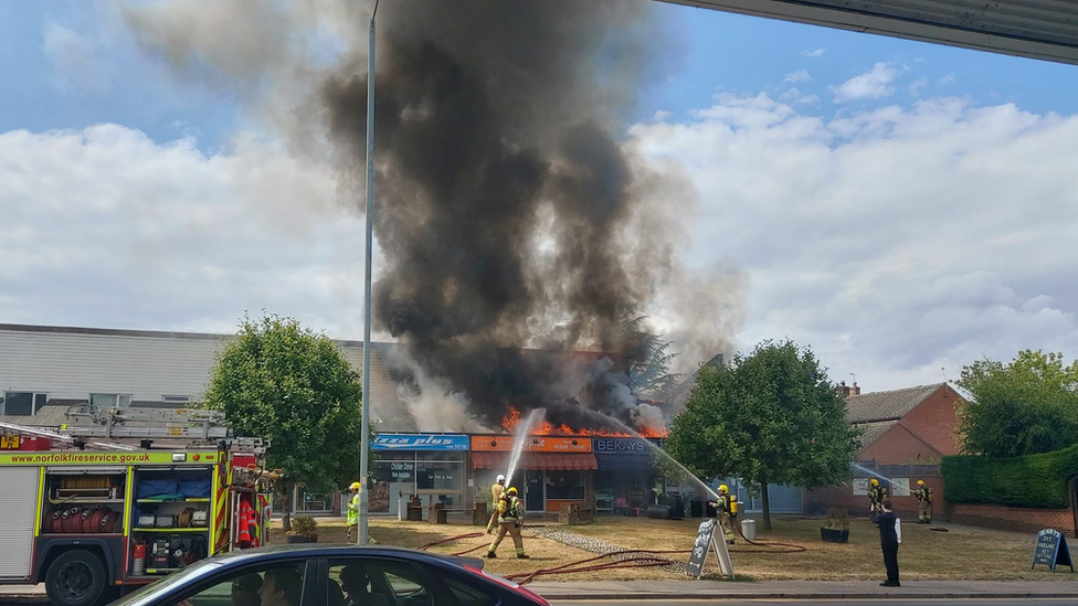 Long Stratton flat residents 'lose everything' in shops blaze - BBC News