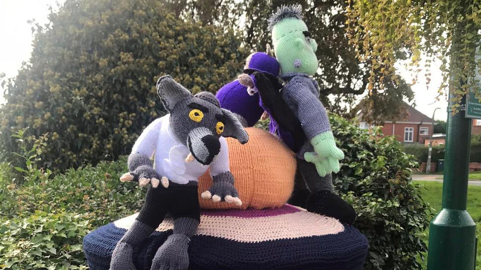 King Charles and Camilla post box topper gets Halloween makeover - BBC News