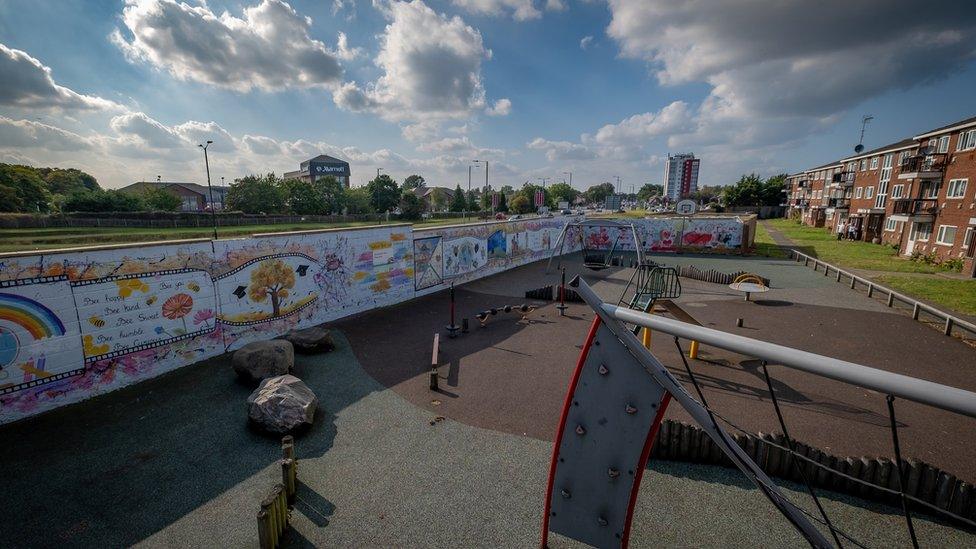 Foxborough community repaint 20-year-old mural - BBC News