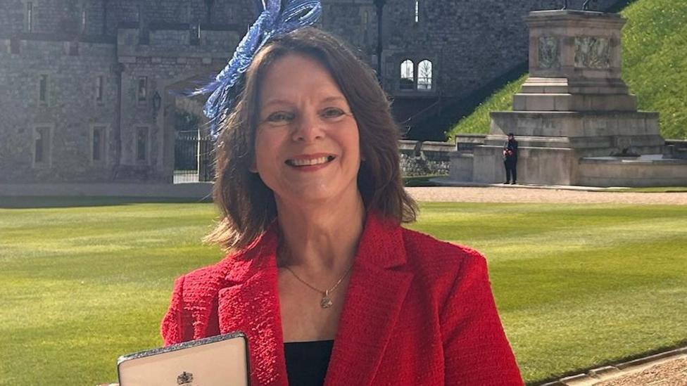 Keele University professor collects MBE from Windsor Castle - BBC News