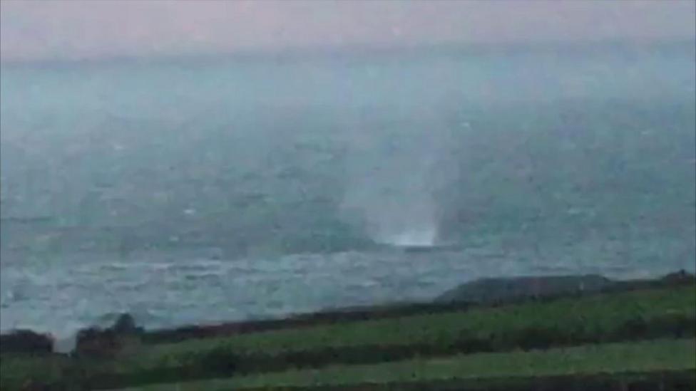 Huge waterspout hits Italy's south-western city - BBC News