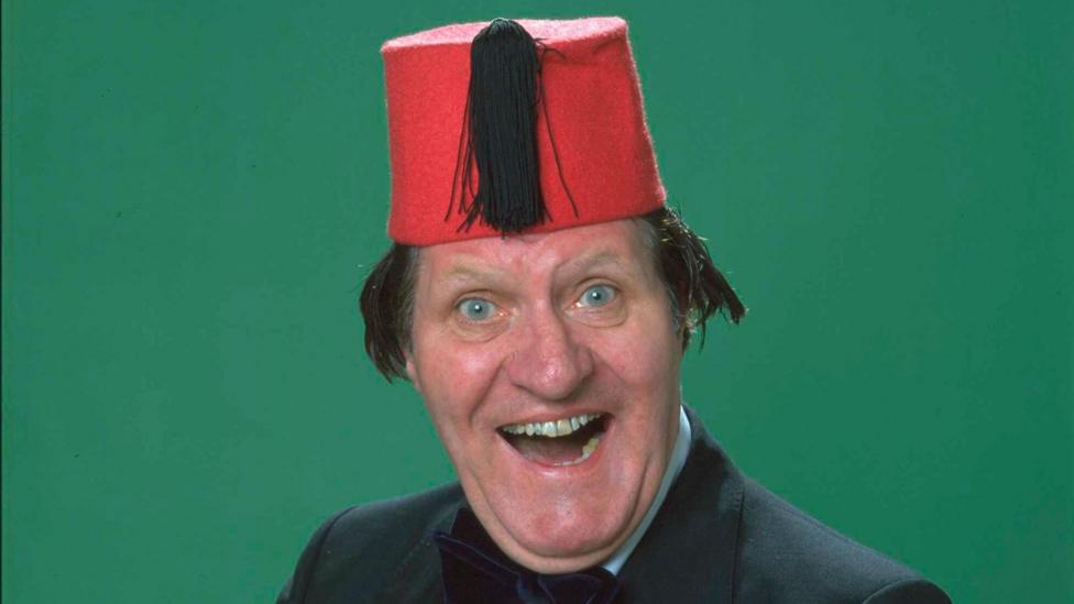 Tommy Cooper's last fez sells for £7k at auction - BBC News