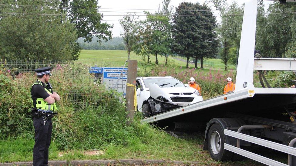 Motorist hurt after train hits car on railway in Johnstone - BBC News