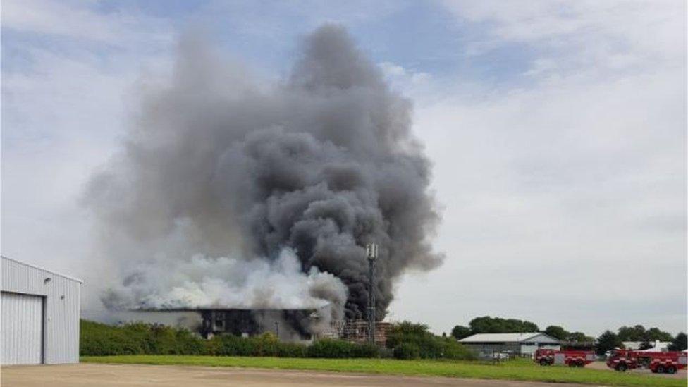 Hangar on fire by Southend Airport runway - BBC News