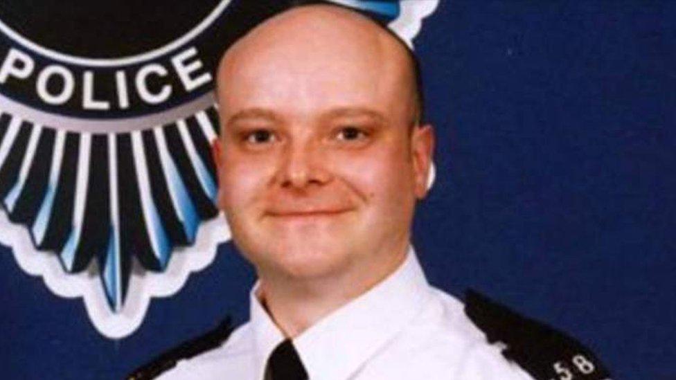 Pc Jon Henry: Street memorial for murdered officer - BBC News