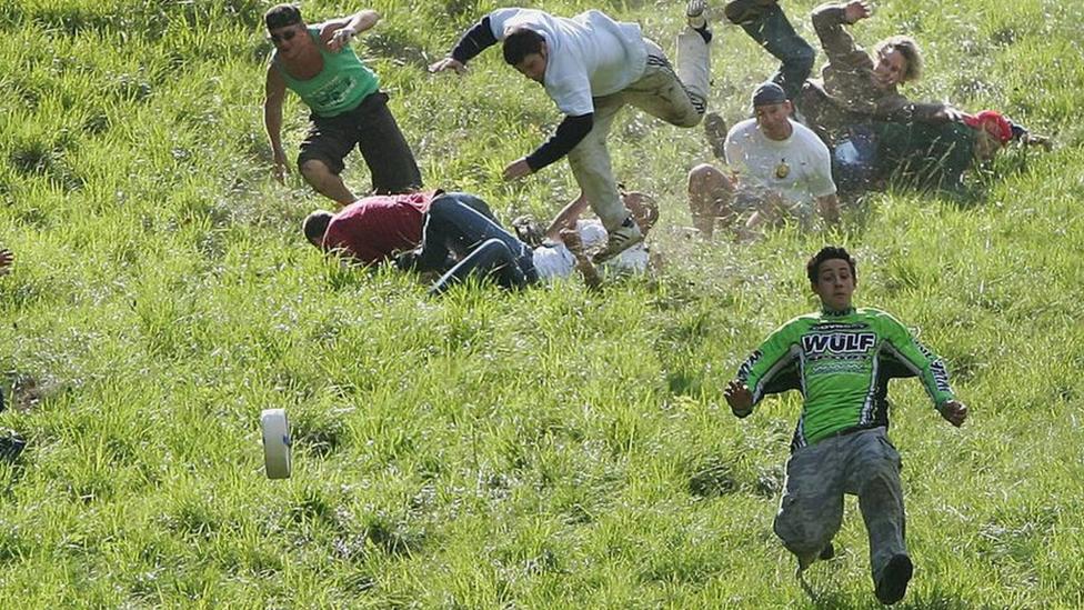 Gloucester cheese-rolling veteran breaks all-time record - BBC News