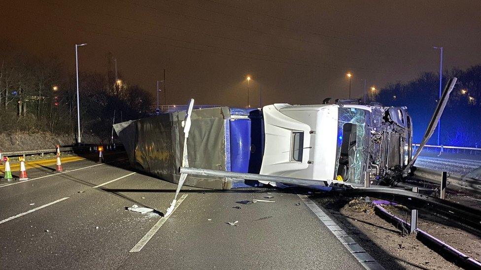 M6 closes at Walsall after lorry crashes through central barrier - BBC News