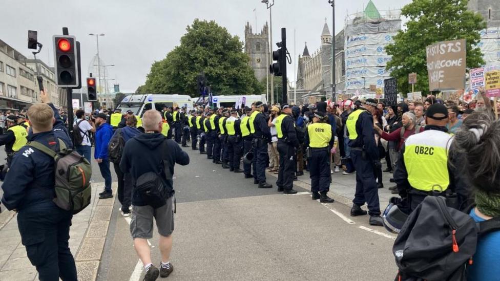 Plymouth police injured and van damaged in city protests - BBC News