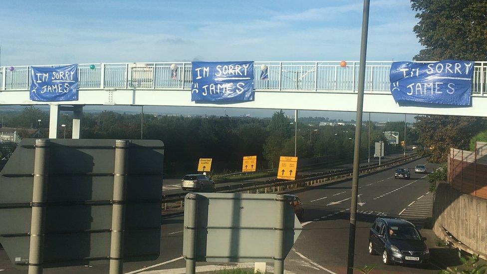 Mystery 'Sorry James' A52 banners removed from bridge - BBC News