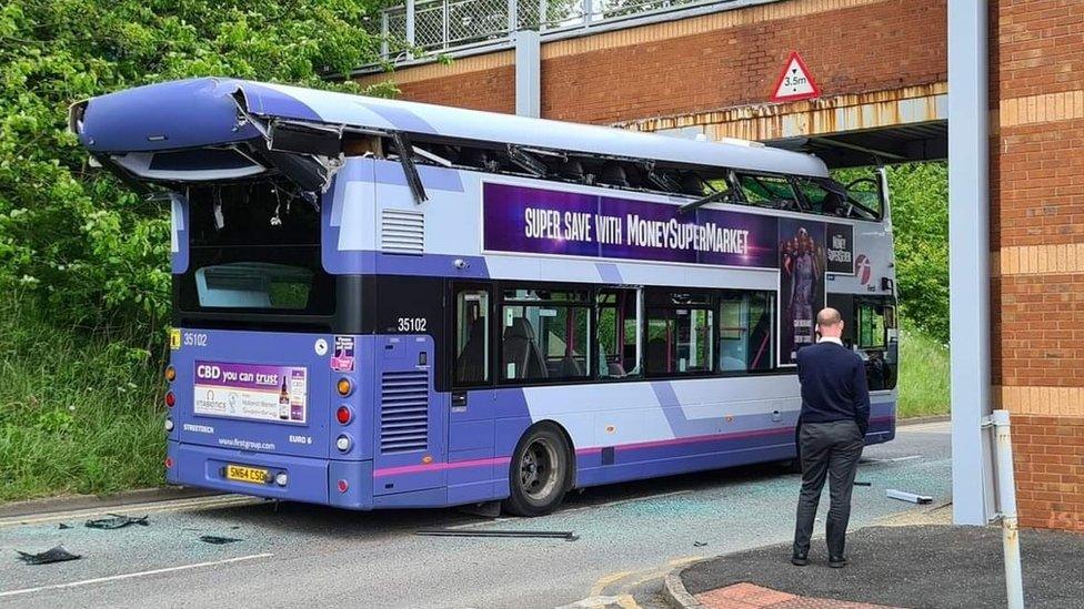 Four passengers hurt as bus hits bridge in Sheffield - BBC News