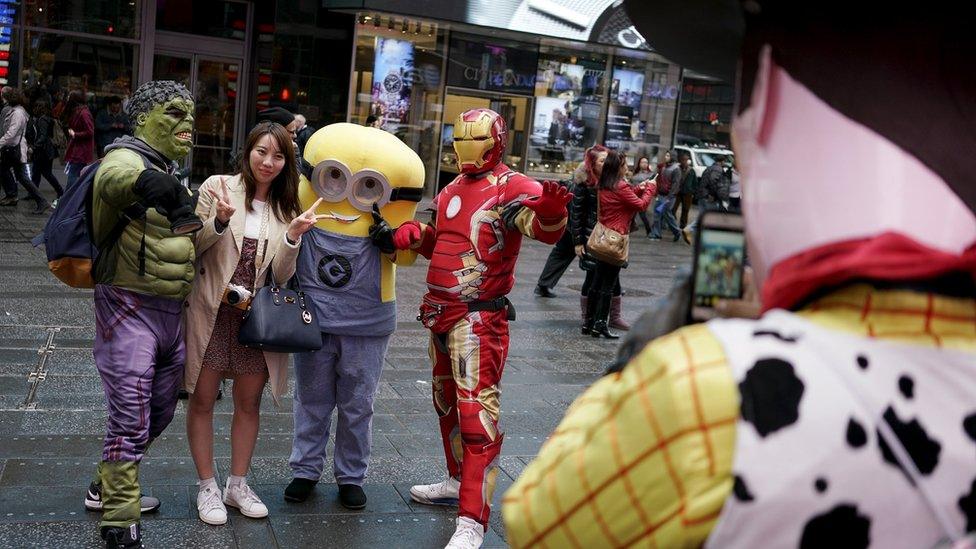 New York cracks down on costumed performers in Times Square - BBC News