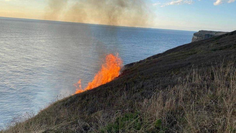 Footpaths closed after Tintagel cliff fire - BBC News