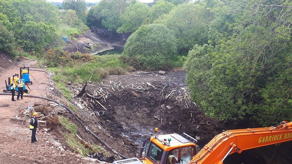 Renee and Andrew MacRae: Flooded quarry drained - BBC News