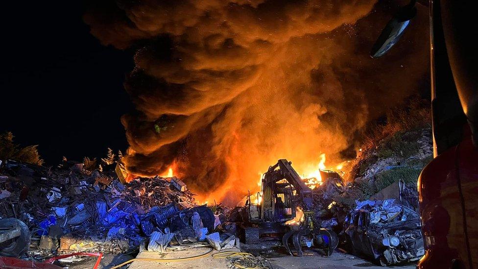 Huge fire rips through scrapyard near Clun - BBC News