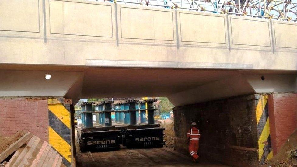 Replacement Norwich rail bridge slides into place - BBC News