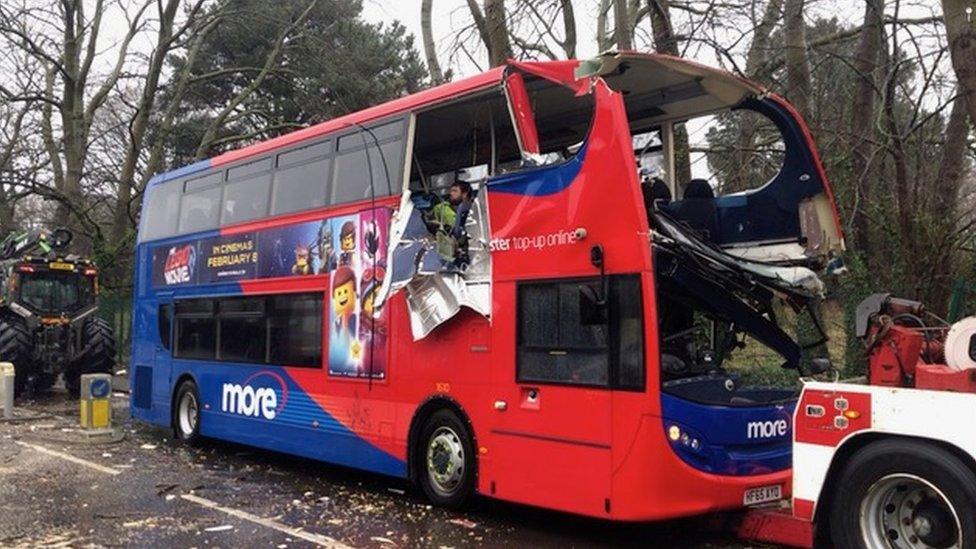 Tree smashes on to double-decker bus in Poole - BBC News
