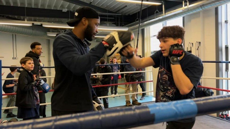 MMA world champion Edwards helps deter teens from crime - BBC News