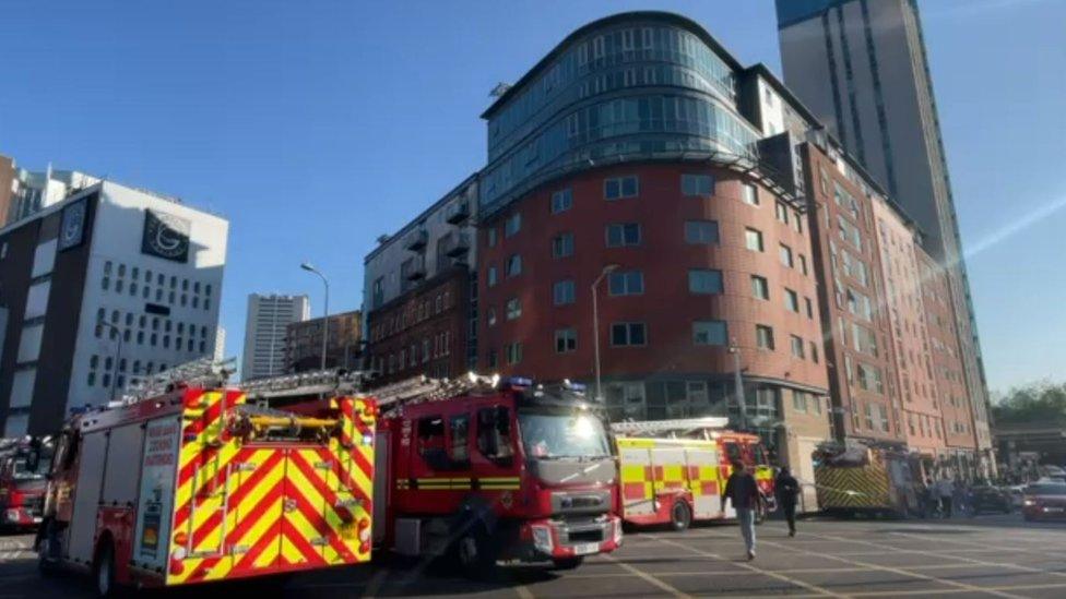 Fire crews rescue 12 people from Birmingham high-rise blaze - BBC News