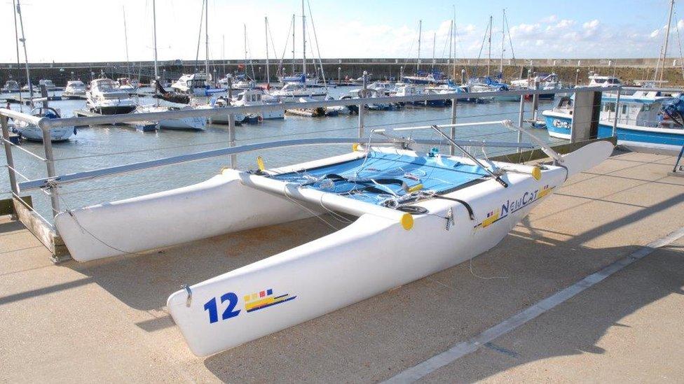 Coastguard search for skipper of upturned catamaran - BBC News