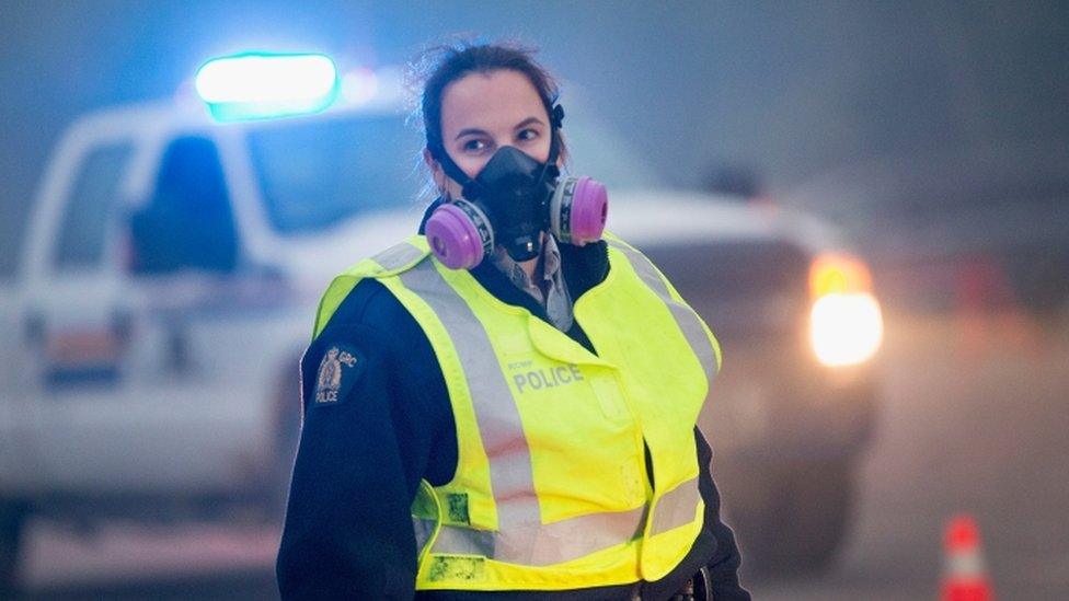 Canada wildfire advance 'slows' as evacuations finish - BBC News