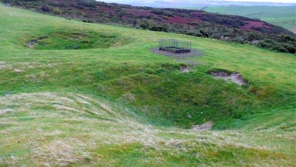 Large sink-hole opens up on Dorset coast path - BBC News