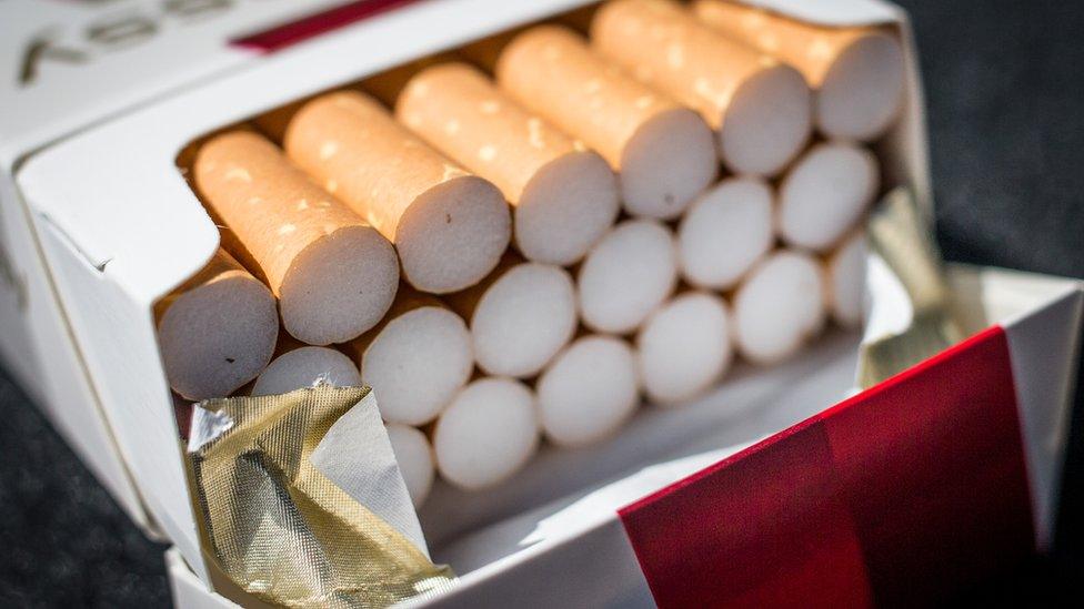 Axa stubs out €1.7bn tobacco industry investment - BBC News