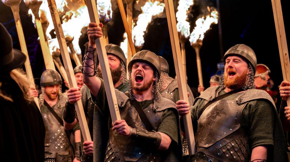Torchlight procession kicks off Edinburgh's Hogmanay celebrations - BBC ...
