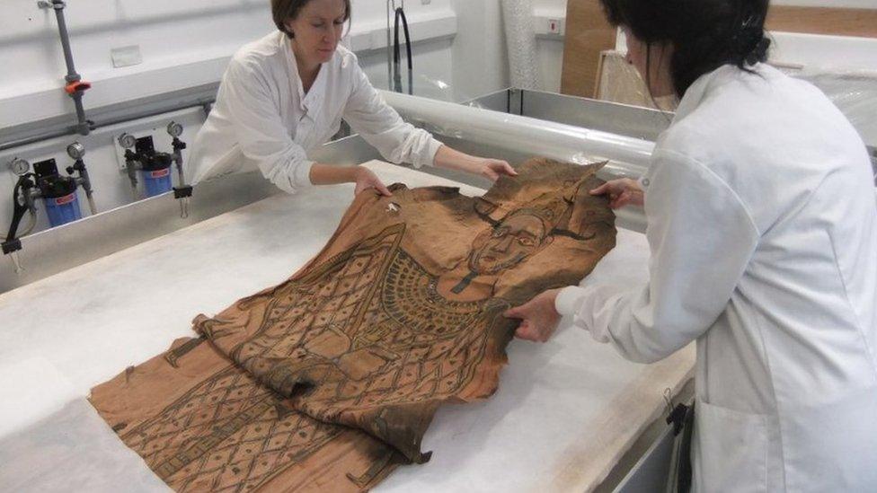 Mummy shroud found after 80 years in museum collection - BBC News