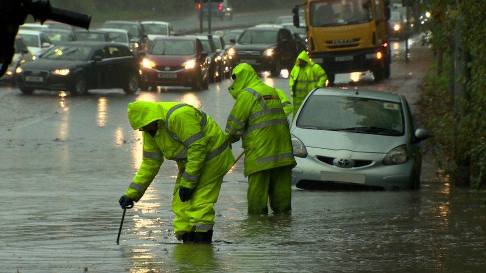 NI flooding: Travel disruption as roads and rail lines close - BBC News