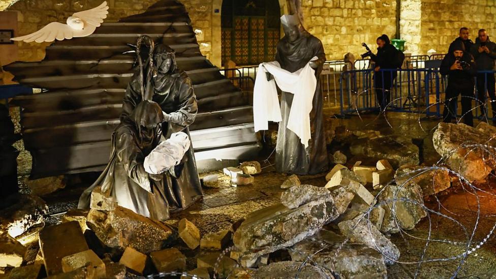 Tewkesbury Abbey's rubble nativity scene highlights children affected ...