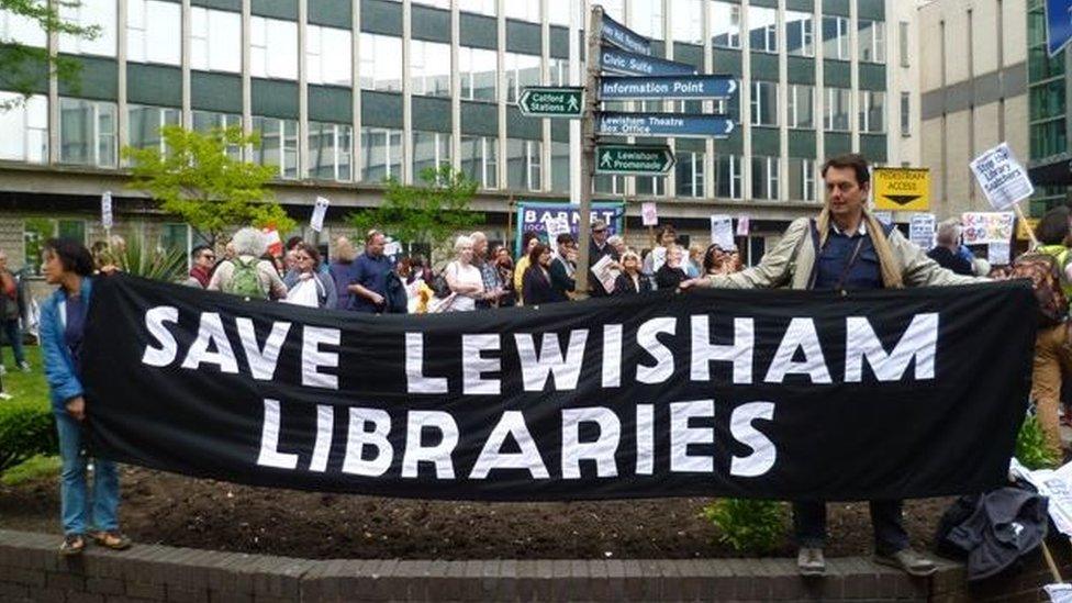 Hundreds protest against Lewisham library cuts - BBC News