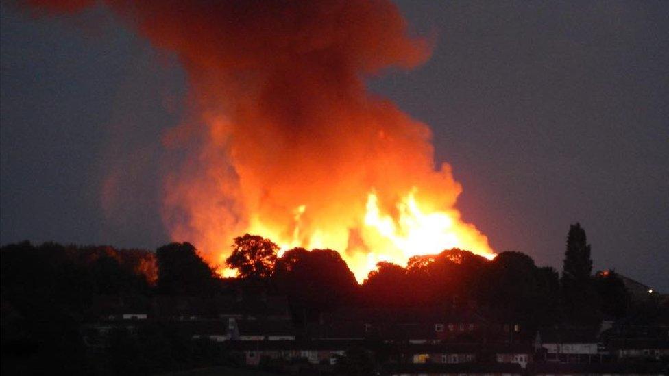 Church Gresley fire engulfs stack of pallets - BBC News