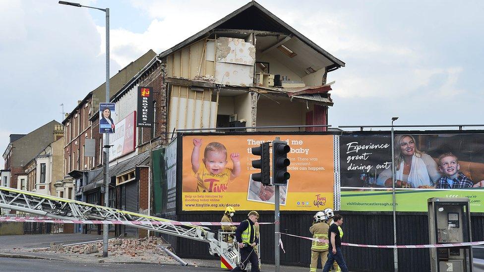 North Belfast: Collapsed wall on building closes Antrim road - BBC News
