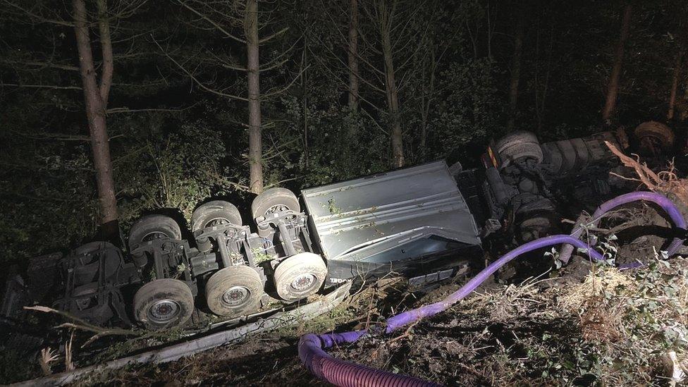 M11 crash: Car struck by lorry after being involved in crash - BBC News