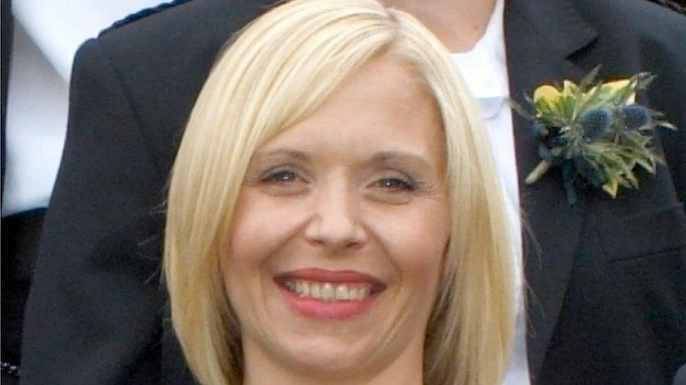 Woman 'killed by husband's car' named as Kim Clark - BBC News