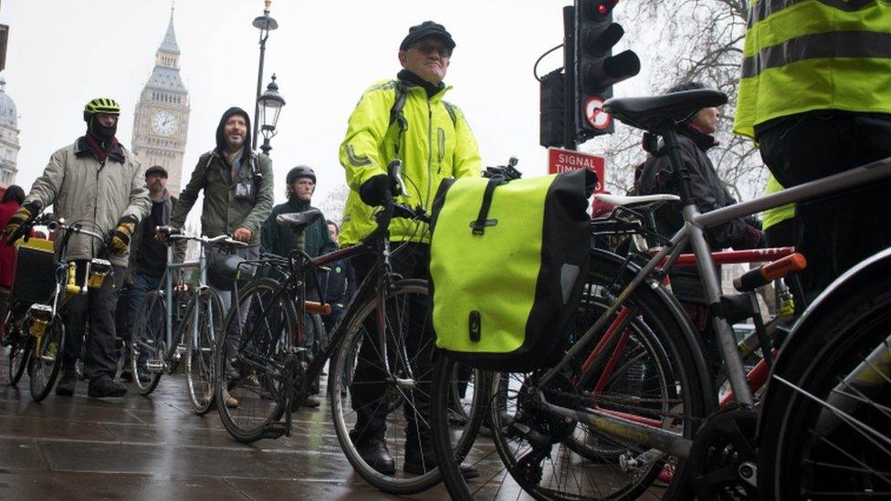 Cyclists stage 'die-in' protest in London for safer roads - BBC News