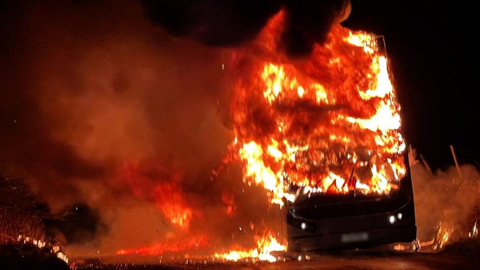 Gloucestershire: School bus catches fire on B4215 in Highleadon - BBC News