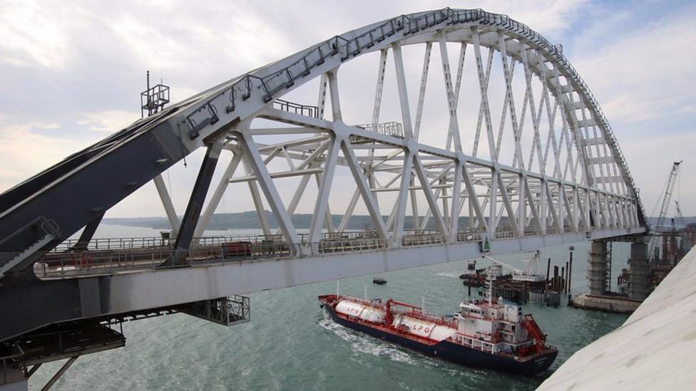 Crimea bridge partly reopens after huge explosion - Russia - BBC News