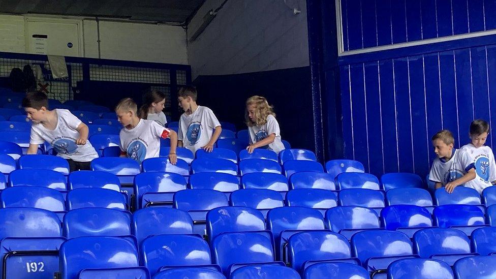 Defibrillator funding: Children complete record bid at Everton - BBC News