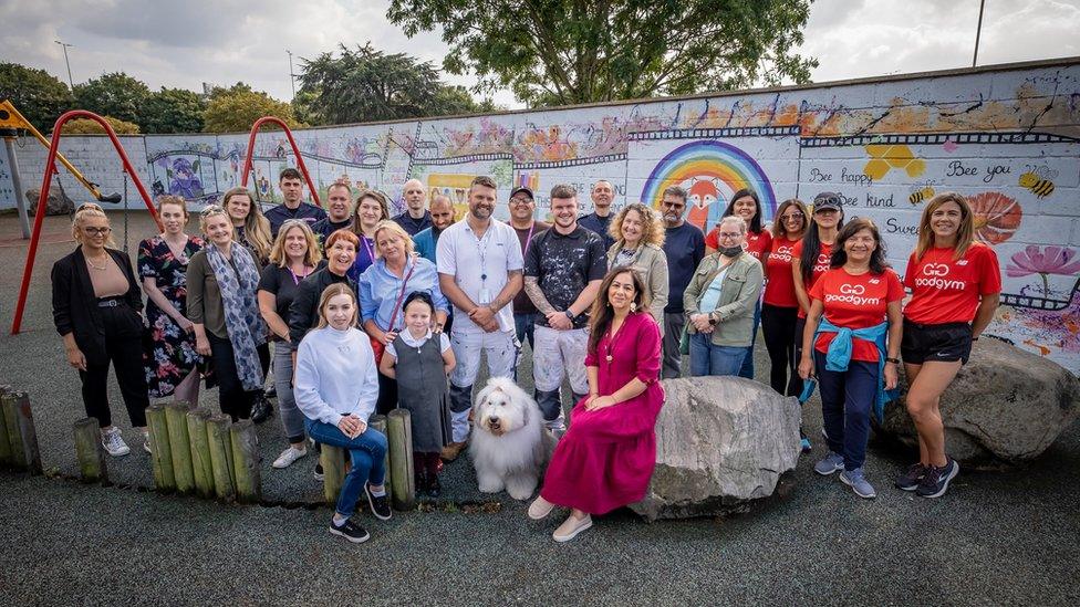 Foxborough community repaint 20-year-old mural - BBC News