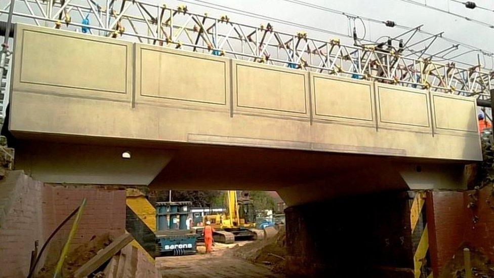 Replacement Norwich rail bridge slides into place - BBC News