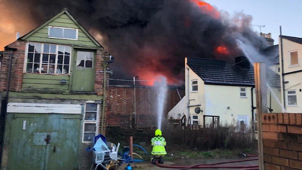 Aldershot people homeless as garage fire spreads to flats - BBC News