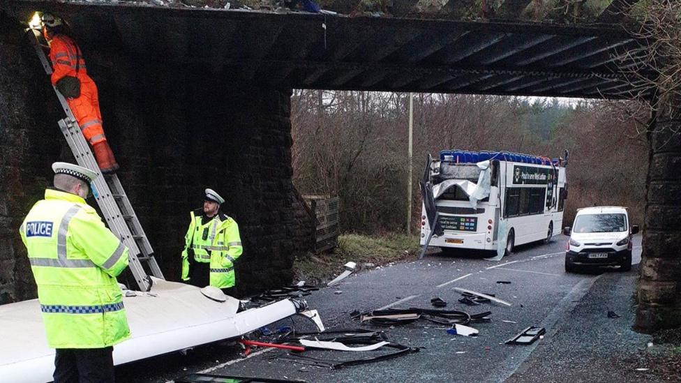 Double decker bus roof ripped off in Fauldhouse bridge crash - BBC News