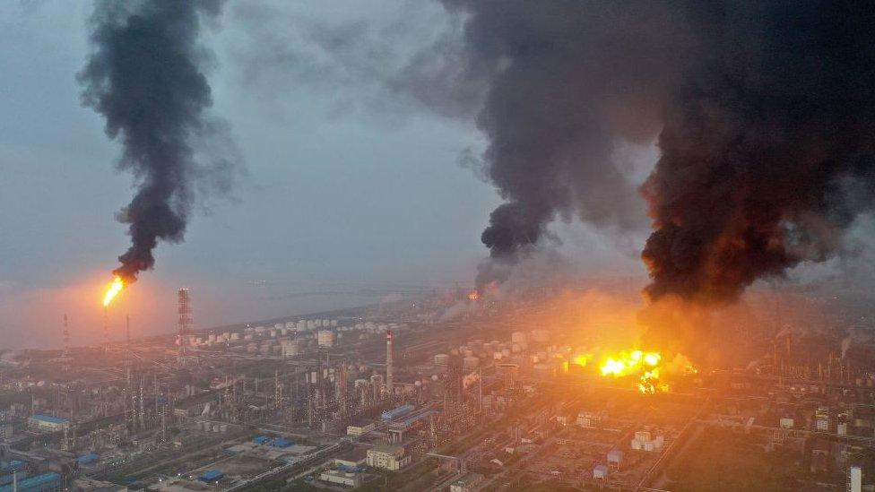 China fire: Skyscraper engulfed in massive flames - BBC News