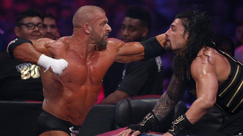 Roman Reigns defeats Triple H at WWE WrestleMania 32 - BBC News